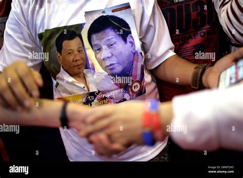 A Filipino Supporter Wears A T Shirt With Pictures Of Philippine President Rodrigo Duterte