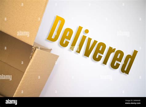 Delivered Word With Cardboard Box Brown Folded Card Box Stock Photo