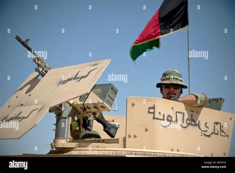 An Afghan Army Special Forces Soldier Provides Security During A Patrol