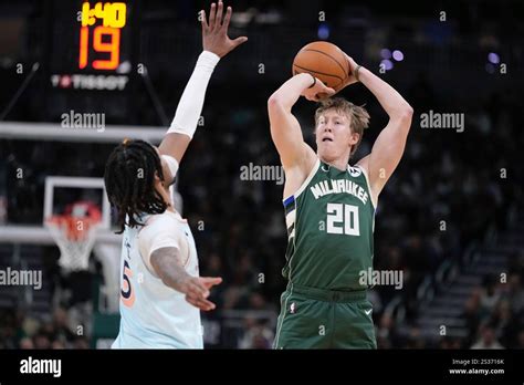Milwaukee Bucks Aj Green Shoots A Three In Front Of San Antonio Spurs Stephon Castle During