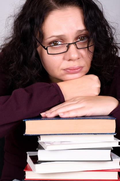Premium Photo Portrait Of Attractive Woman With Stack Of Books