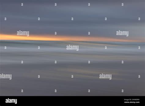 Intentional Camera Movement ICM Image Of Beach Waves At Sunset Stock