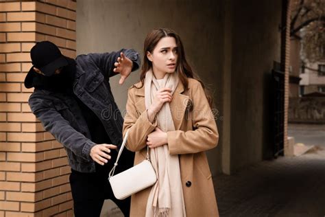 Thief Trying To Steal Woman S Bag In Alley Self Defense Concept Stock