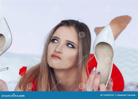 Beautiful Girl In A Red Dress Is Lying On The Bed Stock Image Image Of Hair Glamour 154394701