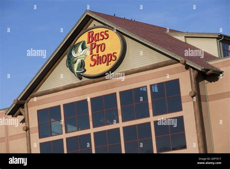 A Logo Sign Outside Of A Bass Pro Shops Retail Store In Mesa Arizona