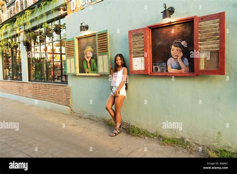 Traveling Tourist Girl Walks Through The Picturesque Street Tropical