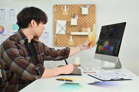 Side View Of Young Man Ux Graphic Designer Working Together For Mobile Application Software