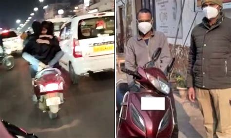 Watch The Trending Video Of Man Romancing On Scooter Later Got Detained