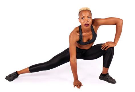 Woman Stretching Legs With Side Lunge Hamstring Stretch