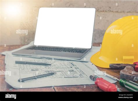 Blueprint Computer Laptop Tool Equipment On Desk For Engineering Design