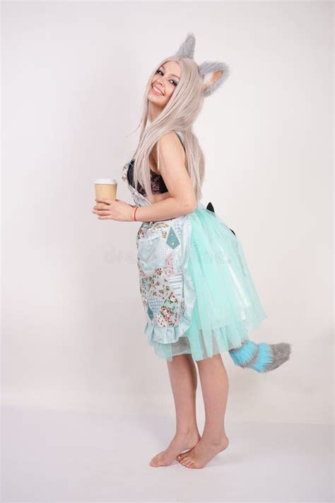 Pretty Playful Young Girl With Cat Ears And Long Fluffy Fur Tail