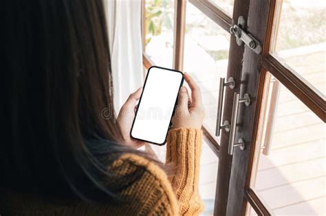 Mock Up Phone In Woman Hand Showing White Screen Mock Up Phone In
