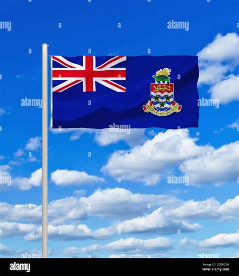 Flag Of The Cayman Islands Against Blue Cloudy Sky Cayman Islands