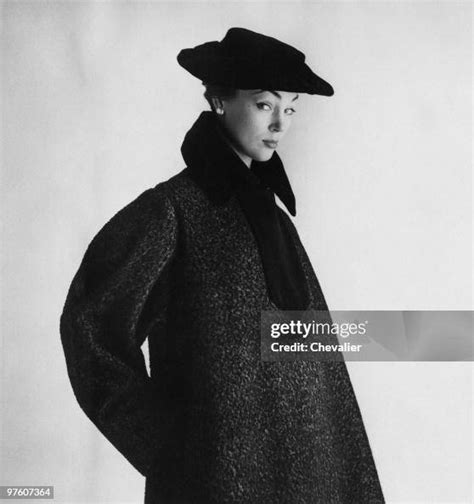 A Woman Modelling A Grey Wool Coat With Black Velvet Trim And News Photo Getty Images