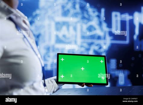 admin uses green screen tablet to develop artificial intelligence