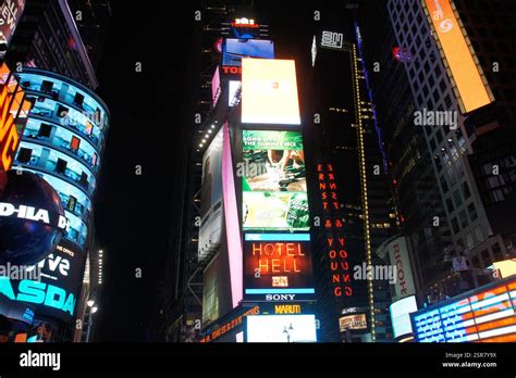 A Dazzling Display Of Colorful Advertisements And Billboards Bathe