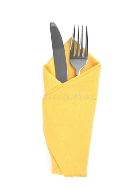 Fork And Knife Wrapped In Yellow Napkin On White Background Top View