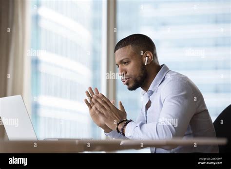 African Businessman Uses Laptop Lead Business Conversation Through