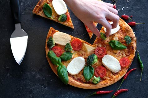 Sliced Pizza With Mozzarella Cheese Tomatoes Broccoli Spices And