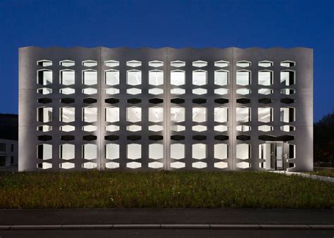 Neutrabuilding Houses Offices Behind A Concrete Shell Covered In Holes