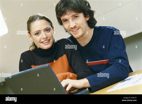 Couple Using Laptop Stock Photo Alamy