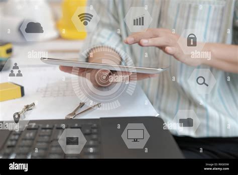 Architect Using Tablet Engineer Working On House Blueprint Of Real Estate Project At Workplace