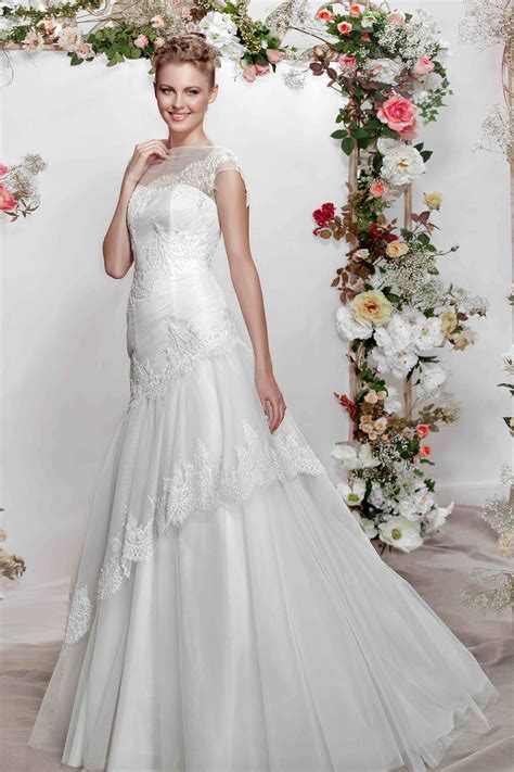 A Woman In A Wedding Dress Posing For The Camera