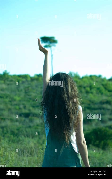 Girl Protecting And Helping A Tree Stock Photo Alamy