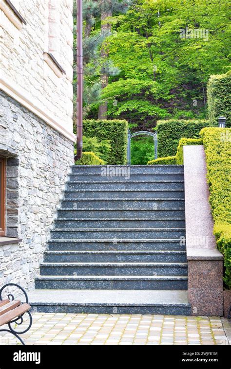 The Steps Of The Stone Staircase Leading To The Park Are Laid On The