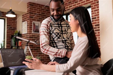Free Photo Programmers Couple Developing Encryption Code On Laptop