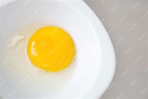 Premium Photo Egg White And Yolk In The Plate Separated From The Shell
