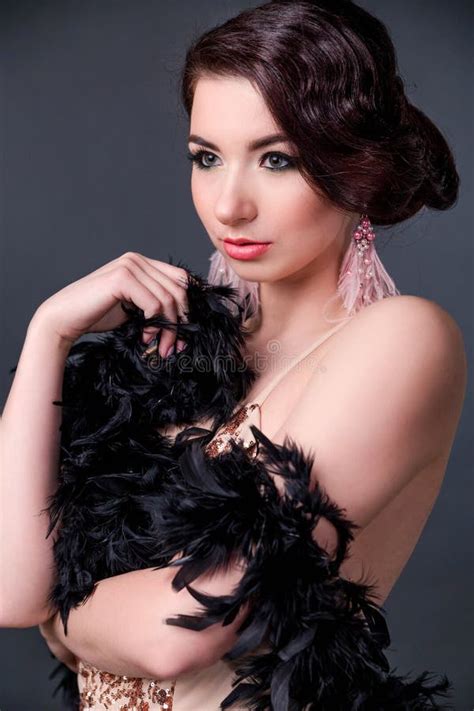 Beautiful Retro Woman From The Roaring 20s Is Posing On Black