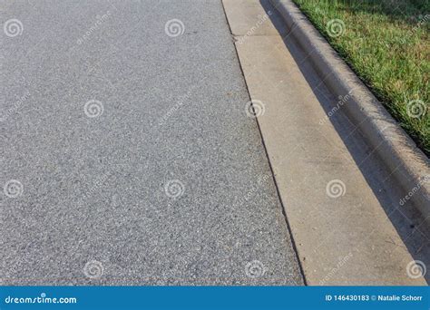 Formed Concrete Curb With Green Grass Asphalt Copy Space Stock Image