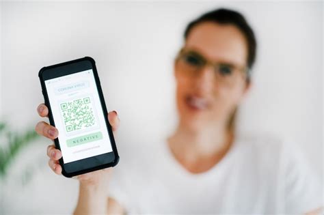 Premium Photo Woman Using Corona Virus Mobile Application With Qr Code
