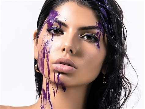 Premium AI Image Portrait Of Model With Violet Face Paint For Magazine