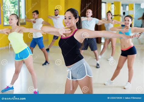 Group Of Positive Young Women And Men Exercising Stock Image Image Of