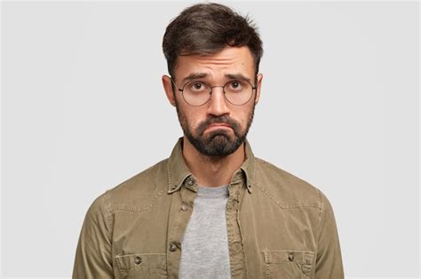 Free Photo Weak Unhappy Male Feels Offended Or Insulted Curves Lips