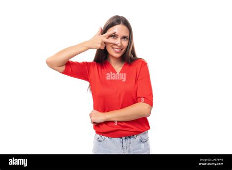 Young Kind Charming Brunette Lady Dressed In A Red T Shirt Smiles