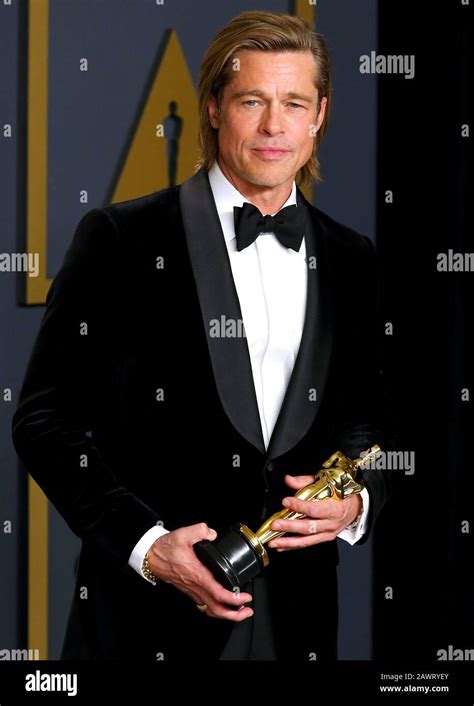 Hollywood Ca February 9 Brad Pitt Poses In The Press Room During