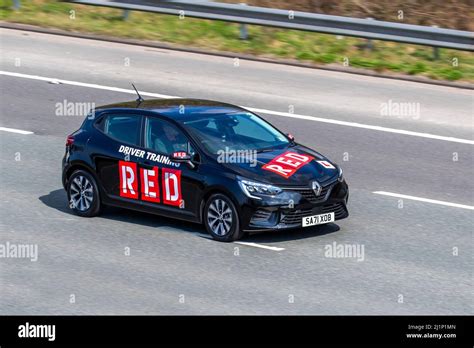 Red Learner Driver Training Black Renault Clio Iconic Tce 5 Speed Manual Driving On The M61