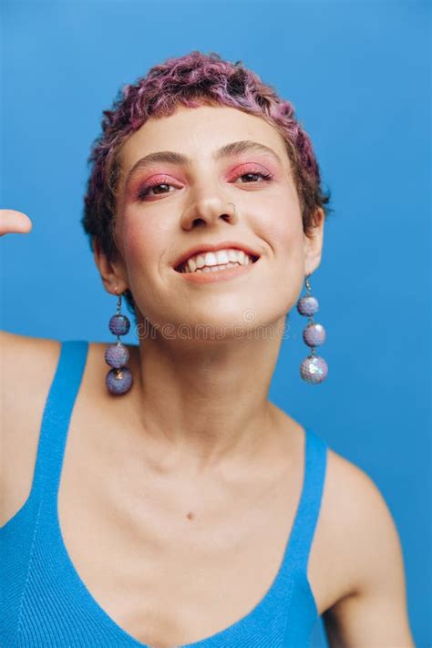 Young Athletic Fashion Woman With Colored Hair And Short Haircut Posing