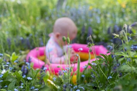 Premium Photo Baby Is Sitting In A Bubble Bath In The Garden On Hot Summer Day