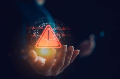 Premium Photo Hand Showing Red Triangle Caution Warning Sign And Global For Maintenance