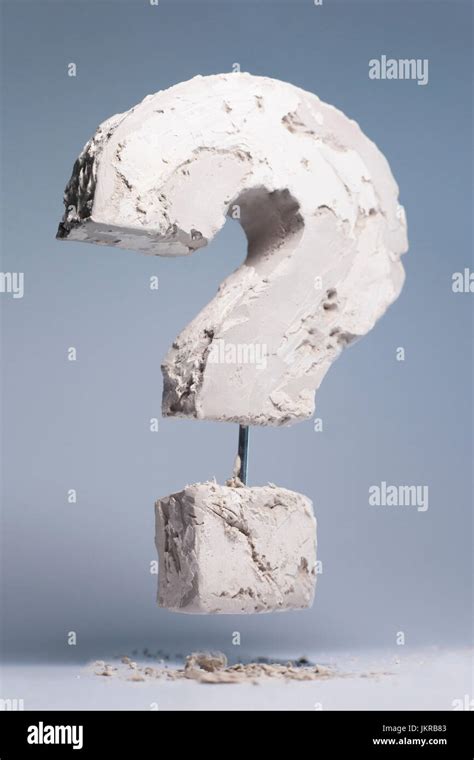 Question Mark Made Of Stone Material Levitating Against Gray Background