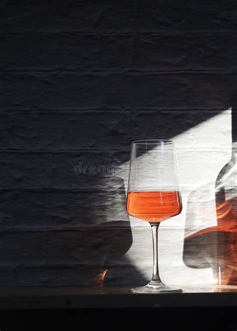 A Glass With Rose Wine And A Bottle Stock Image Image Of Bottle Wall
