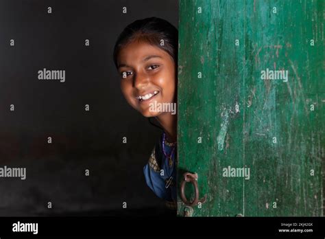 School Girl Peeping From A Classroom Stock Photo Alamy