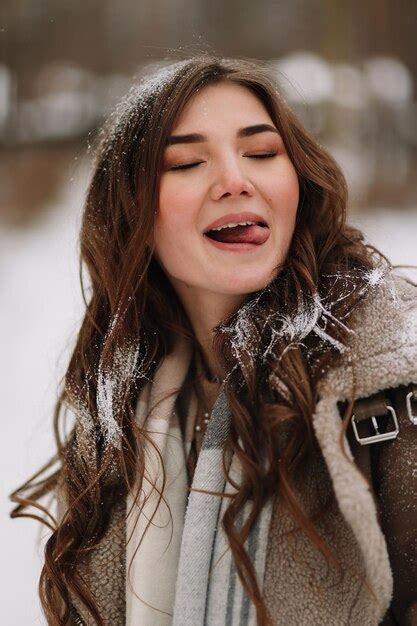 Premium Photo A Funny Pretty Curly Haired Girl In Winter Clothes Is