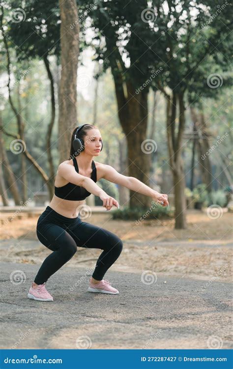 In An Autumn City Park Background A Stunning Sportswoman In Sportswear