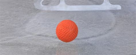Premium Photo Orange Ball For Bandy On Ice