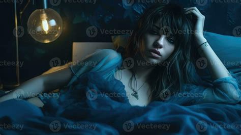Ai Generated Beautiful Woman Lying On A Blue Bedspread With Sheets